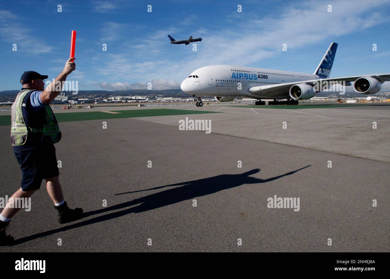 a380 005 mac.jpg The ground crew directs the A380 along the tarmac at ...