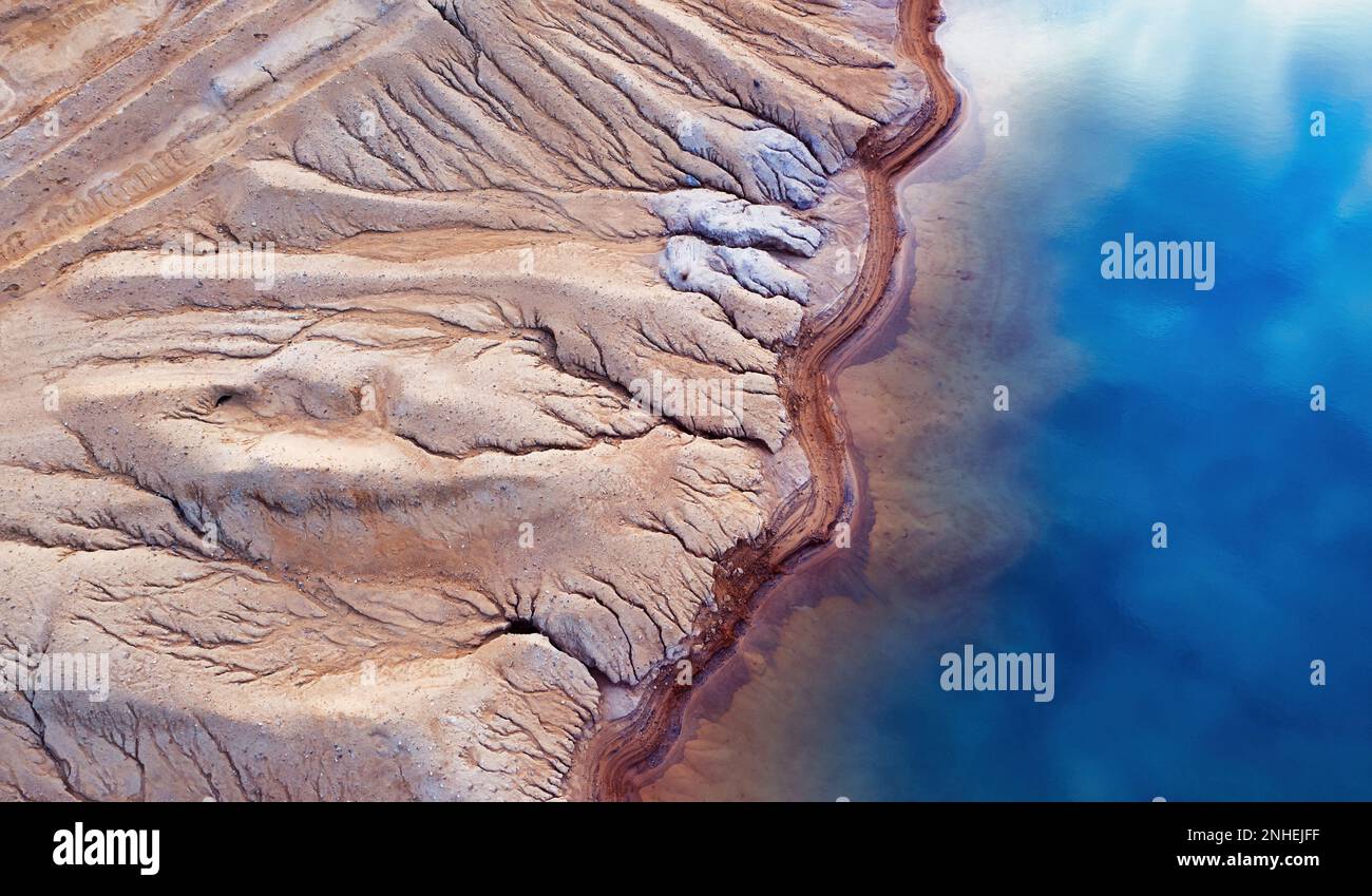 vast titanium mine with tailing ponds filled with technical fluids used ...