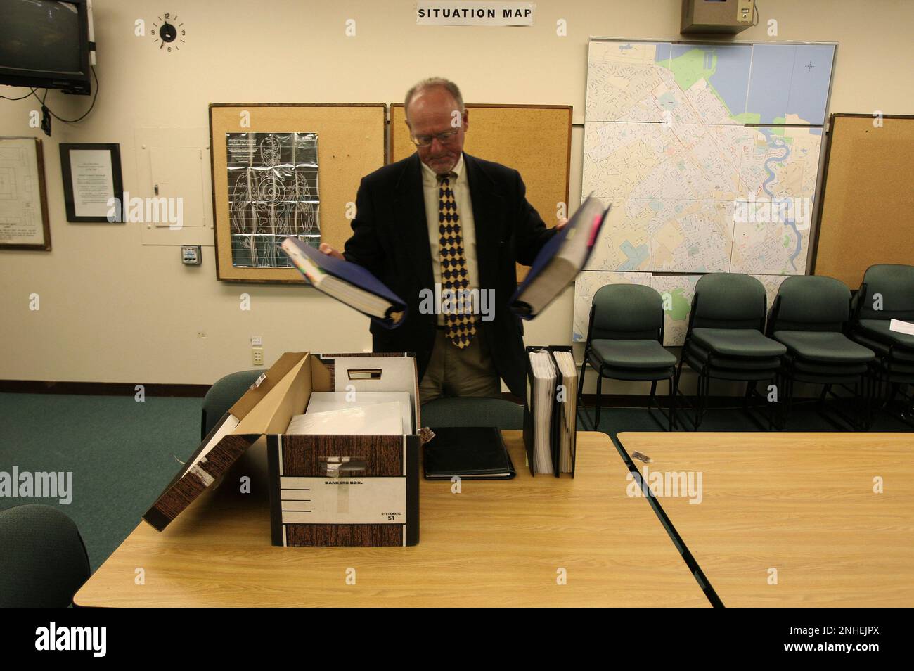 coldcase 162 mac.jpg Detective Pete Bahnmueller fills boxes with ...