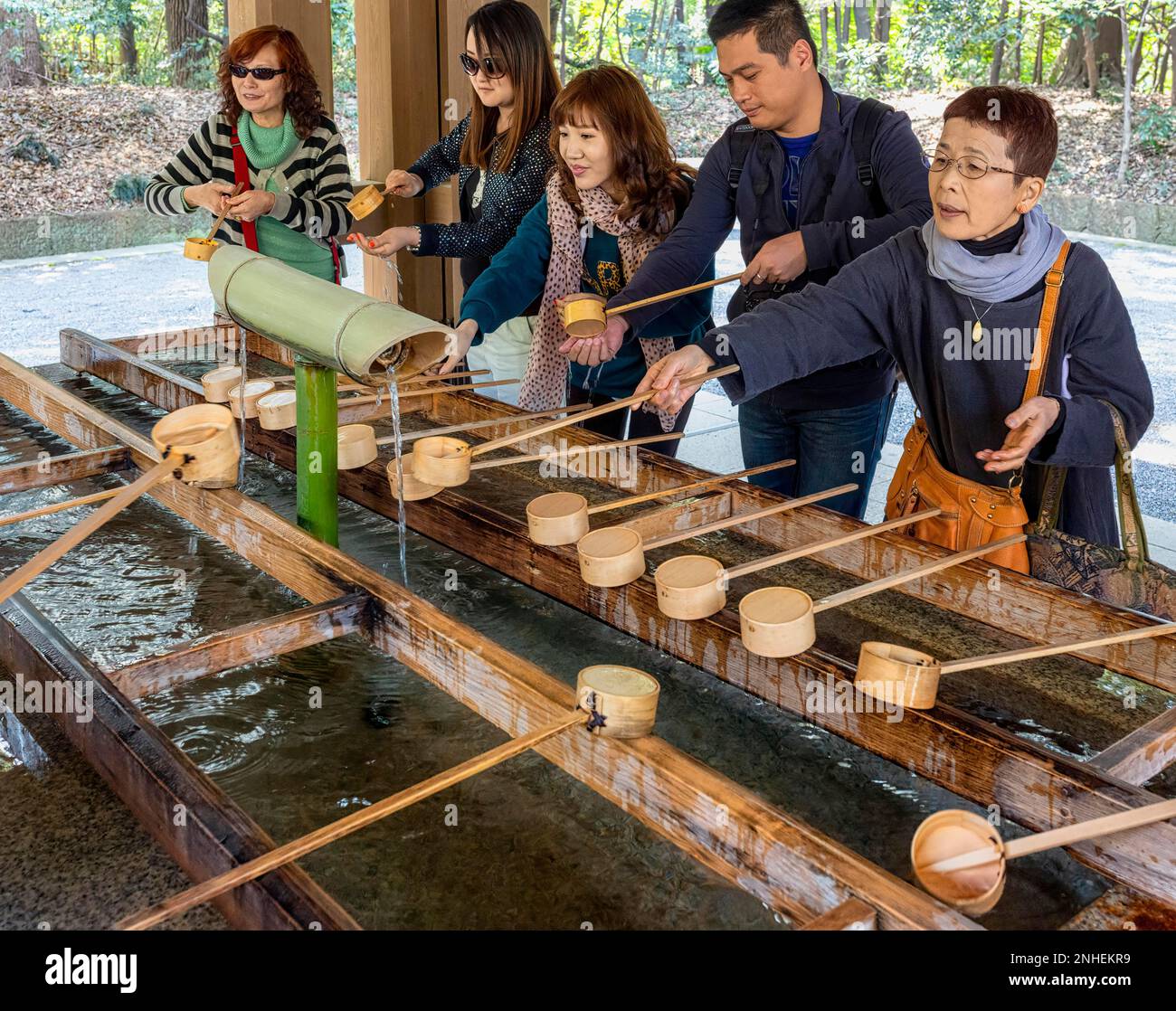 Tokyo Japan. Cleaning hands at the entrance of Meiji Jingu Shinto ...