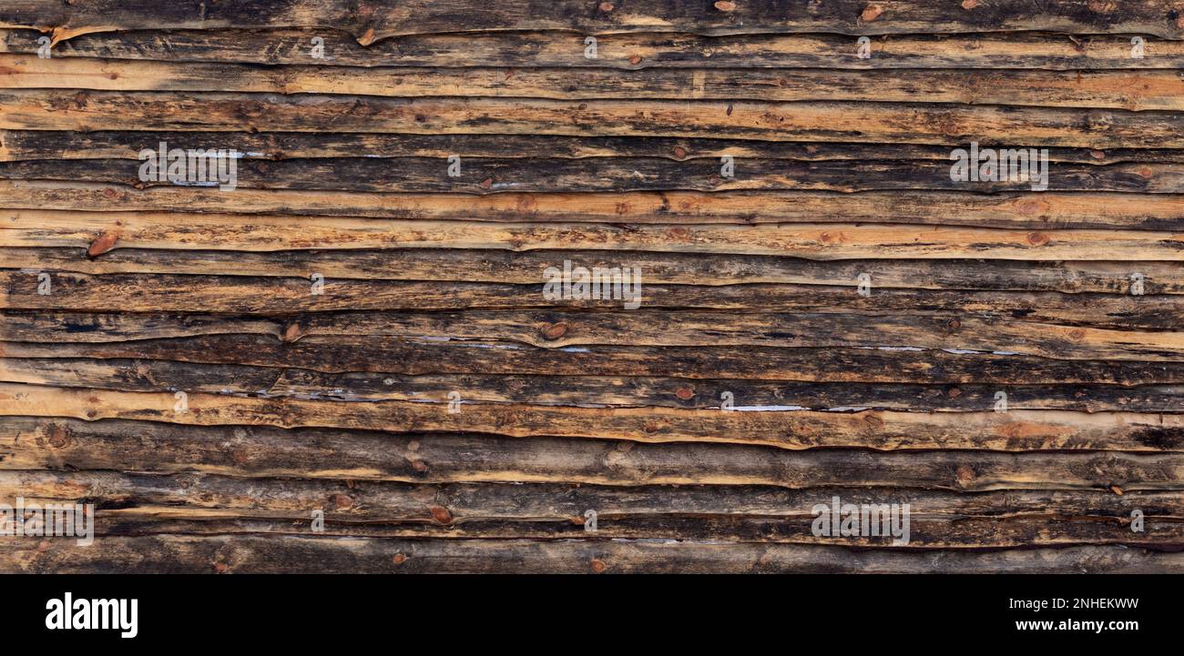 weathered wooden wall that has naturally aged and decayed over time ...