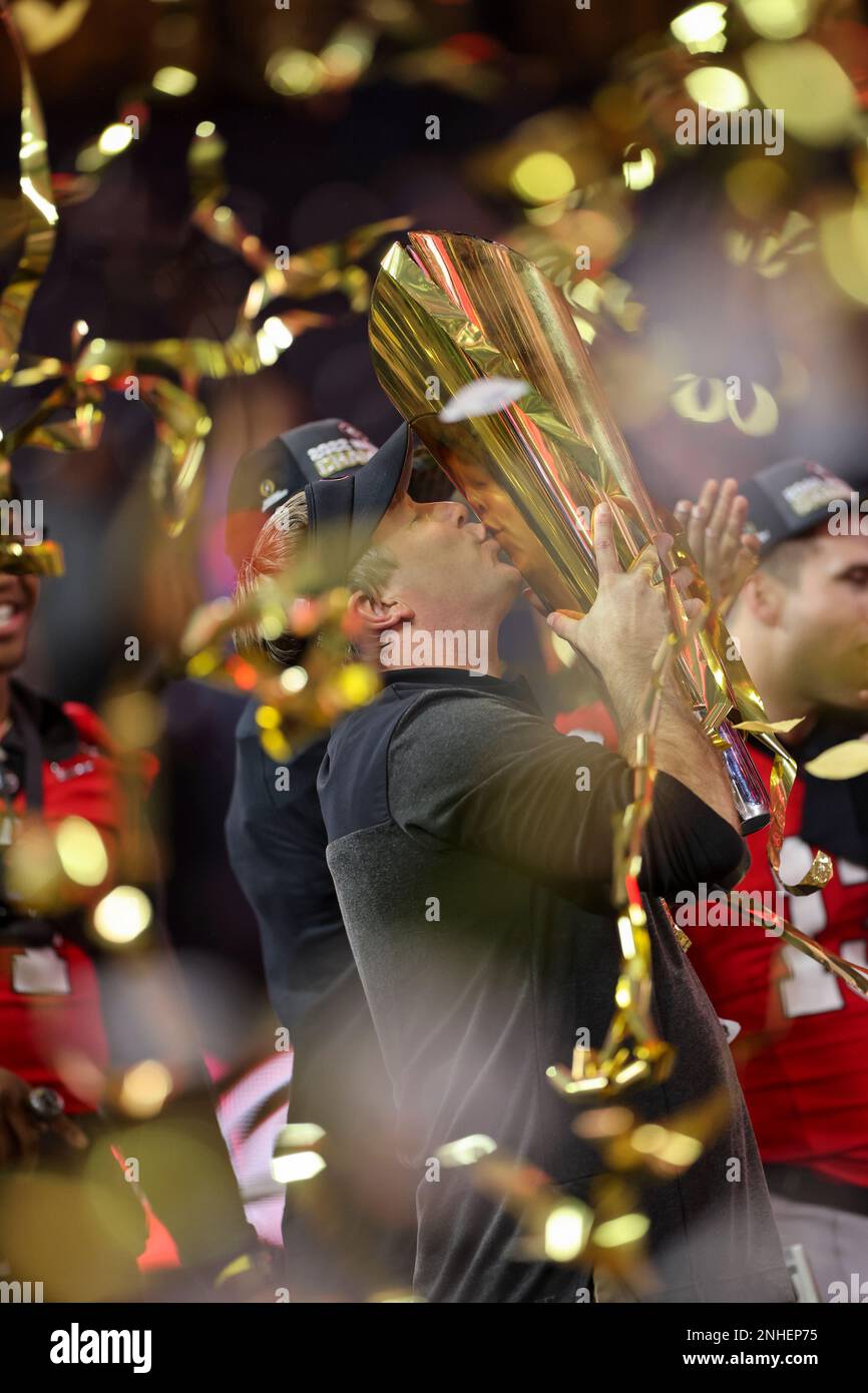 Georgia Bulldogs head coach Kirby Smart kisses the trophy after winning ...