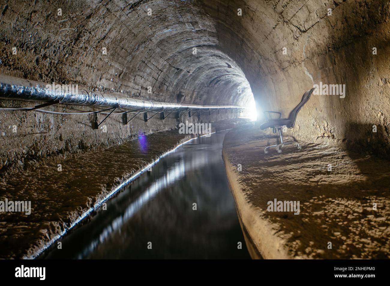 Underground vaulted urban sewer tunnel with dirty sewage Stock Photo ...