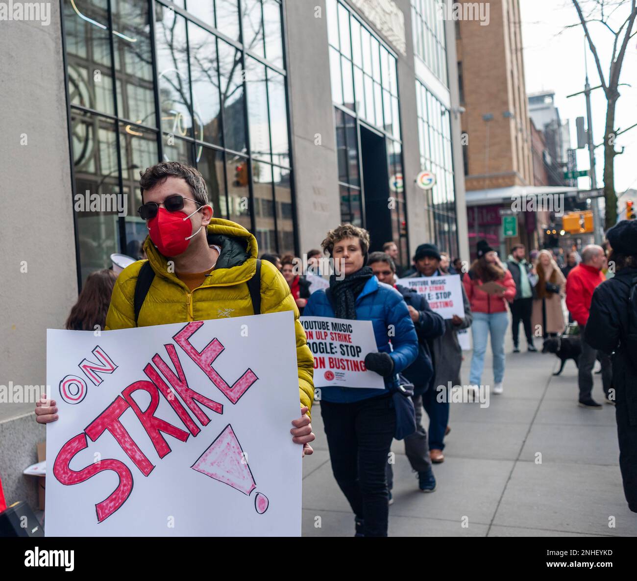 YouTube workers and supporters rally outside of the Google building in ...