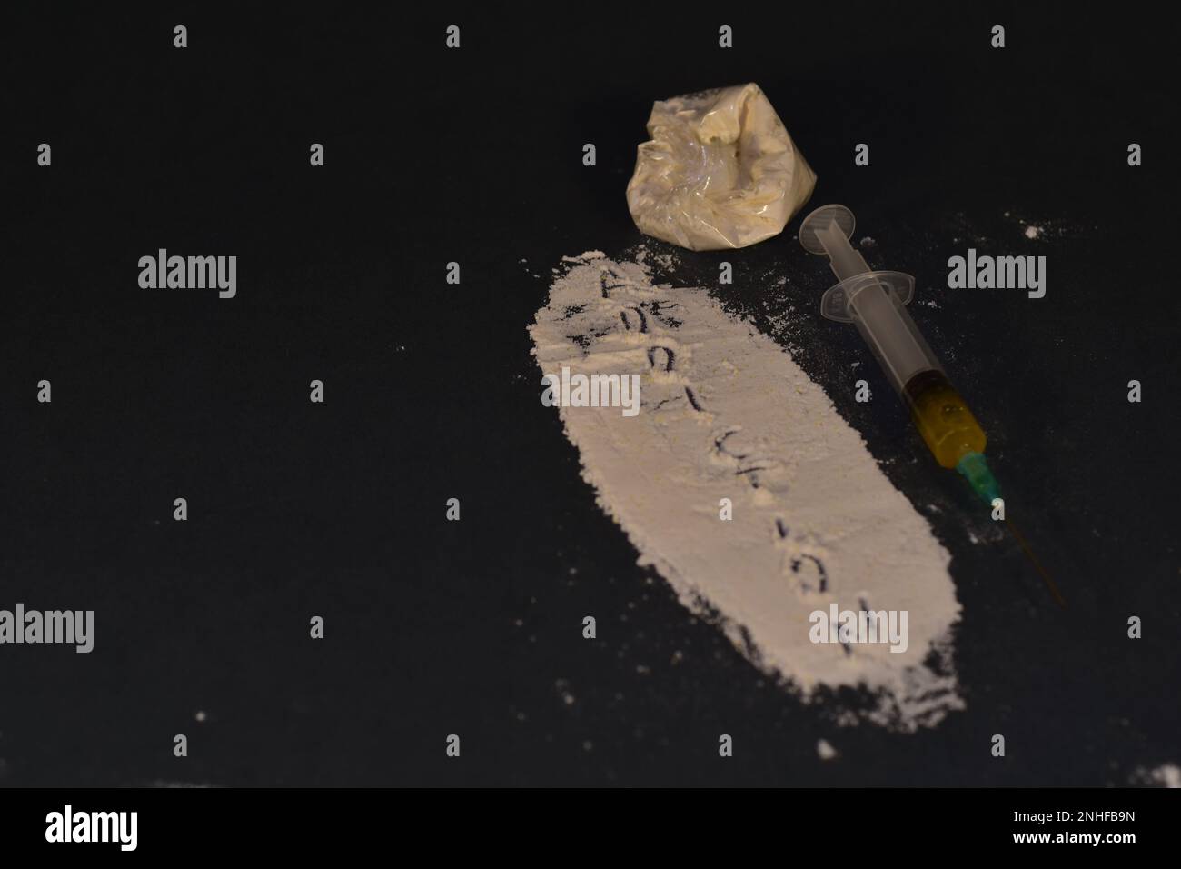 Addiction concept drugs white powder and syringe with needle Stock ...