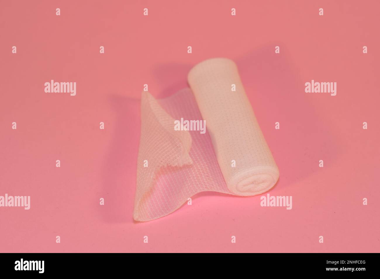 First aid kit bandage on a pink background medical Stock Photo - Alamy