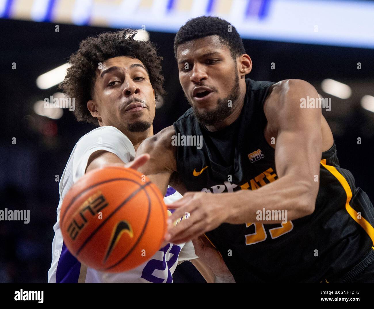 James Madison forward Julien Wooden (22) tries to steal the ball from ...