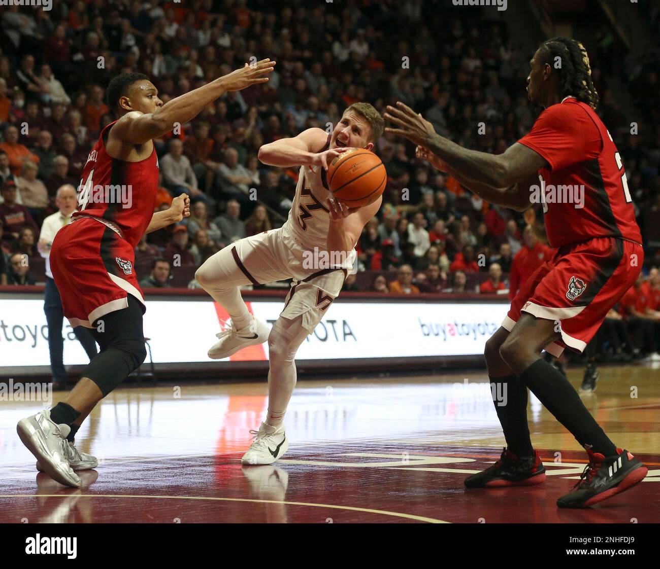Virginia Tech's Sean Pedulla (3) center, drives toward the basket while ...
