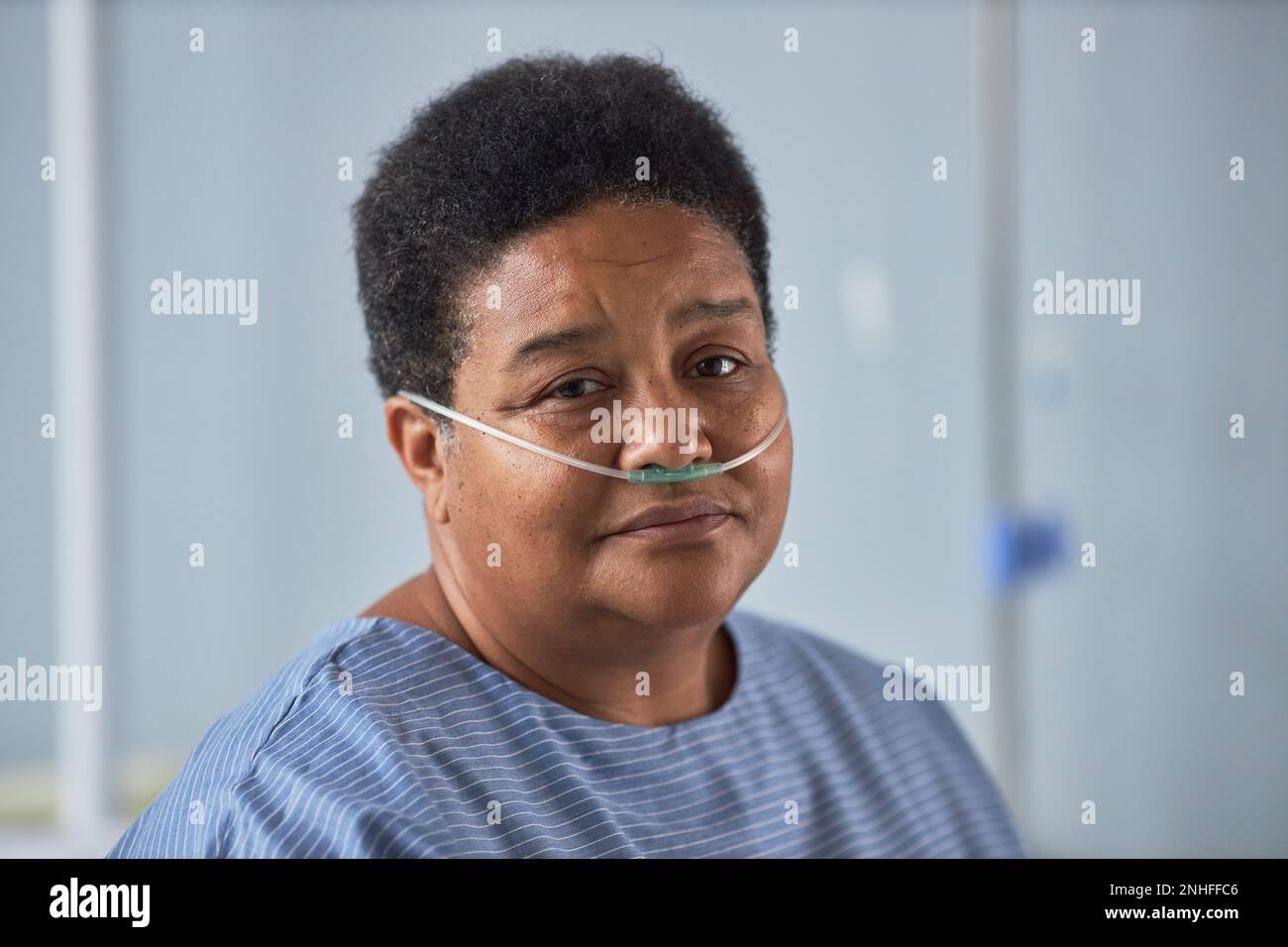 Close up portrait of black senior woman looking at camera in hospital ...