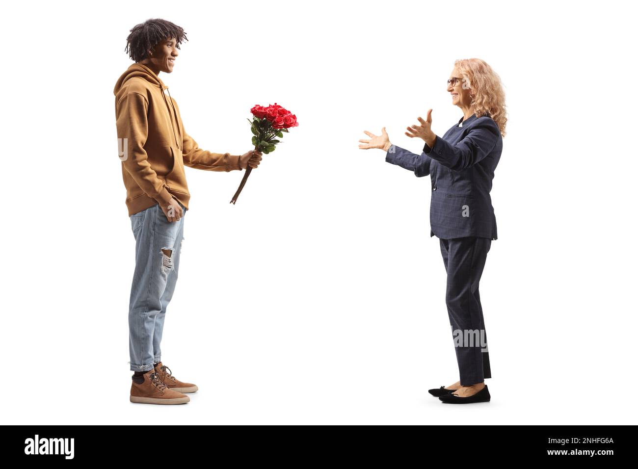 Young african american man giving red roses to a surprised mature woman ...