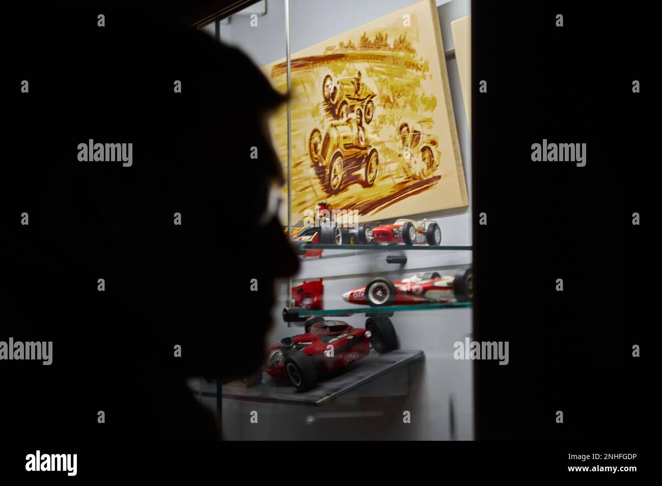 A man's face figure making a shadow in front of a luminous vintage ...