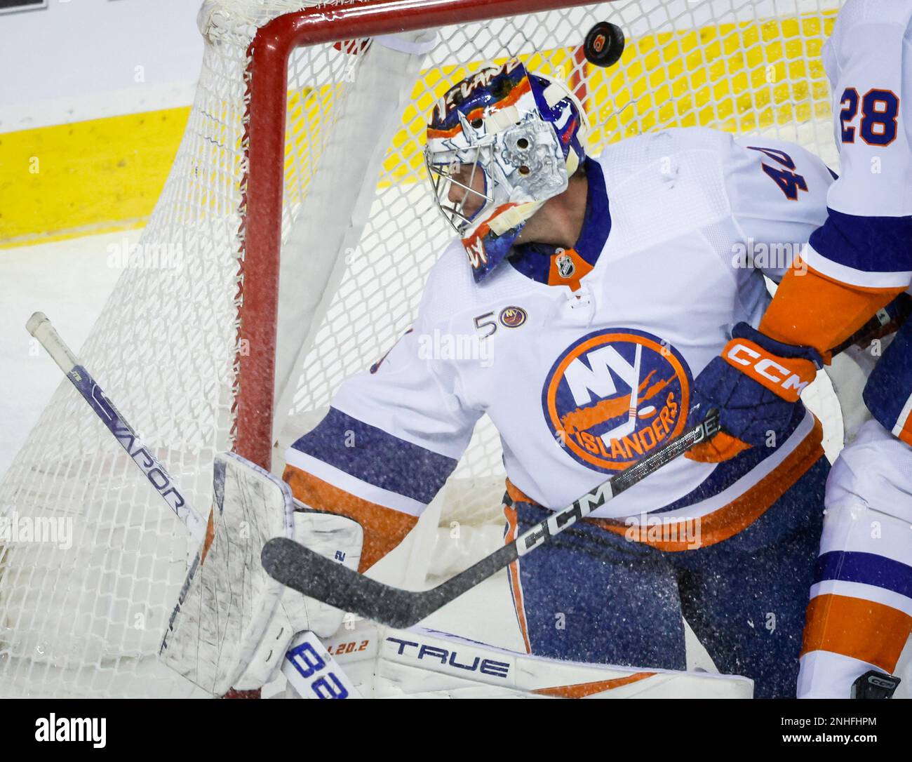 New York Islanders goalie Semyon Varlamov looks for the puck as the ...
