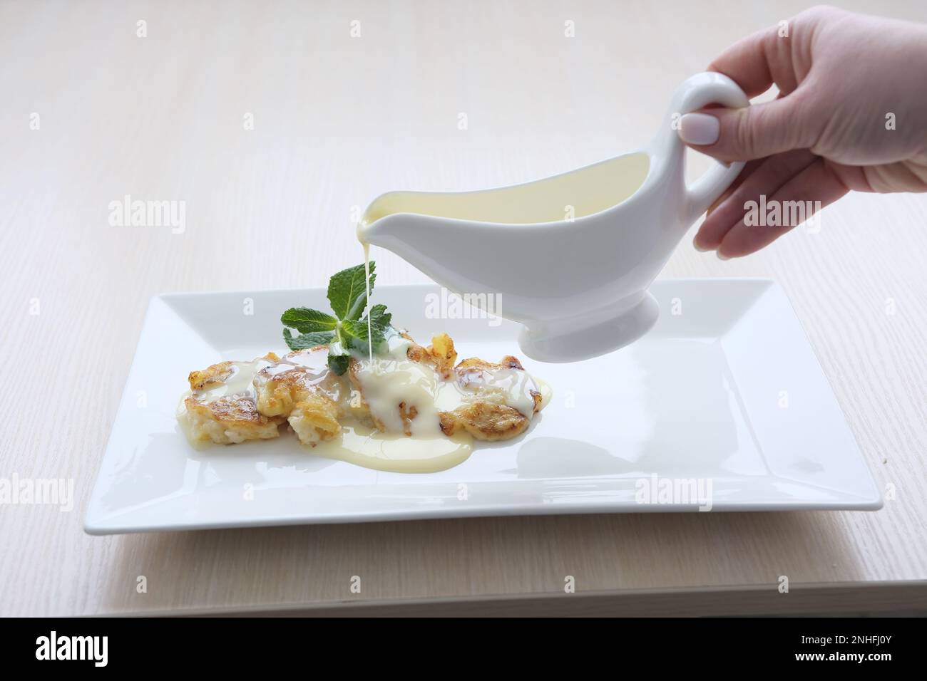 Pouring honey milk slow motion hi-res stock photography and images - Alamy