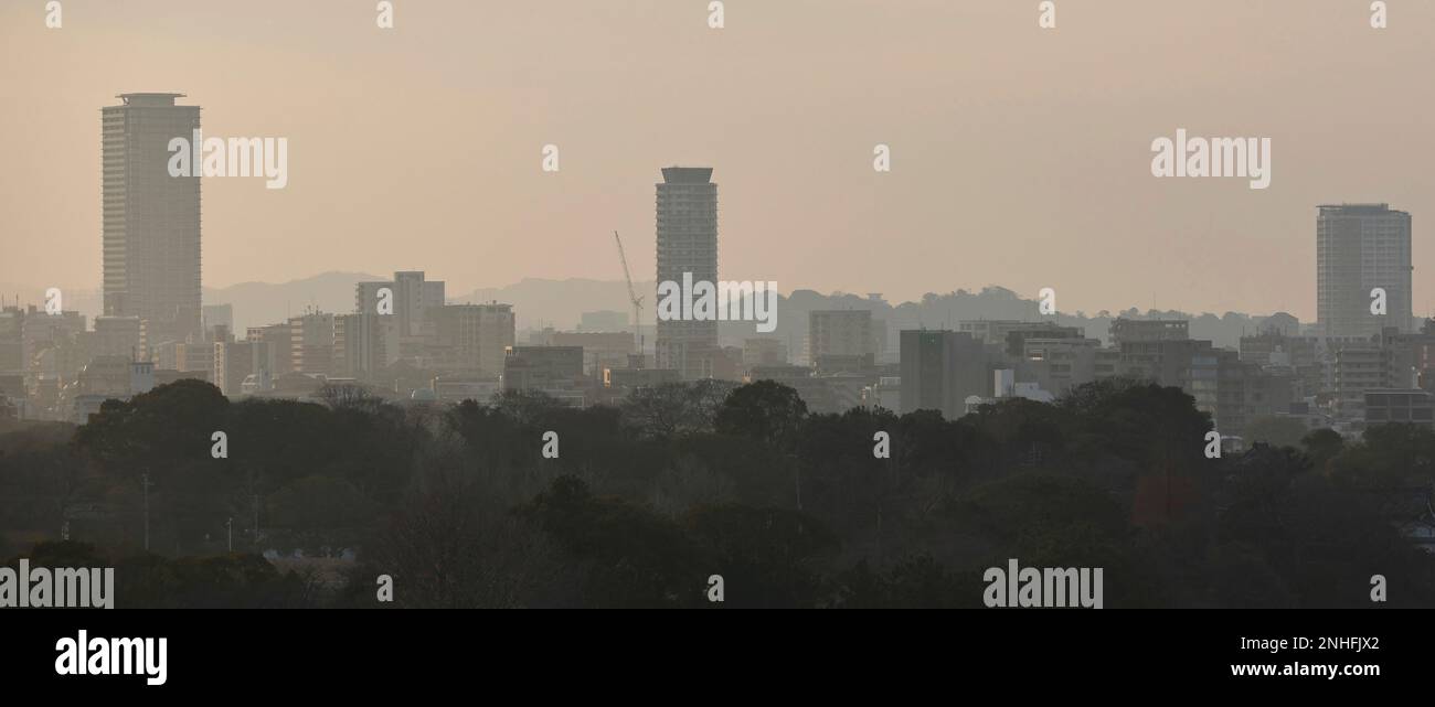 A photo shows yellow sand and air pollution covering the city of ...