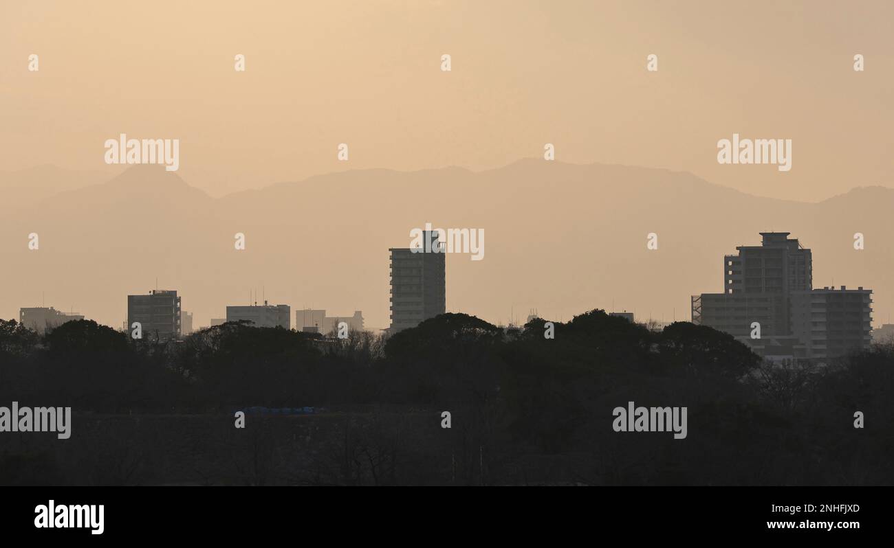 A photo shows yellow sand and air pollution covering the city of ...