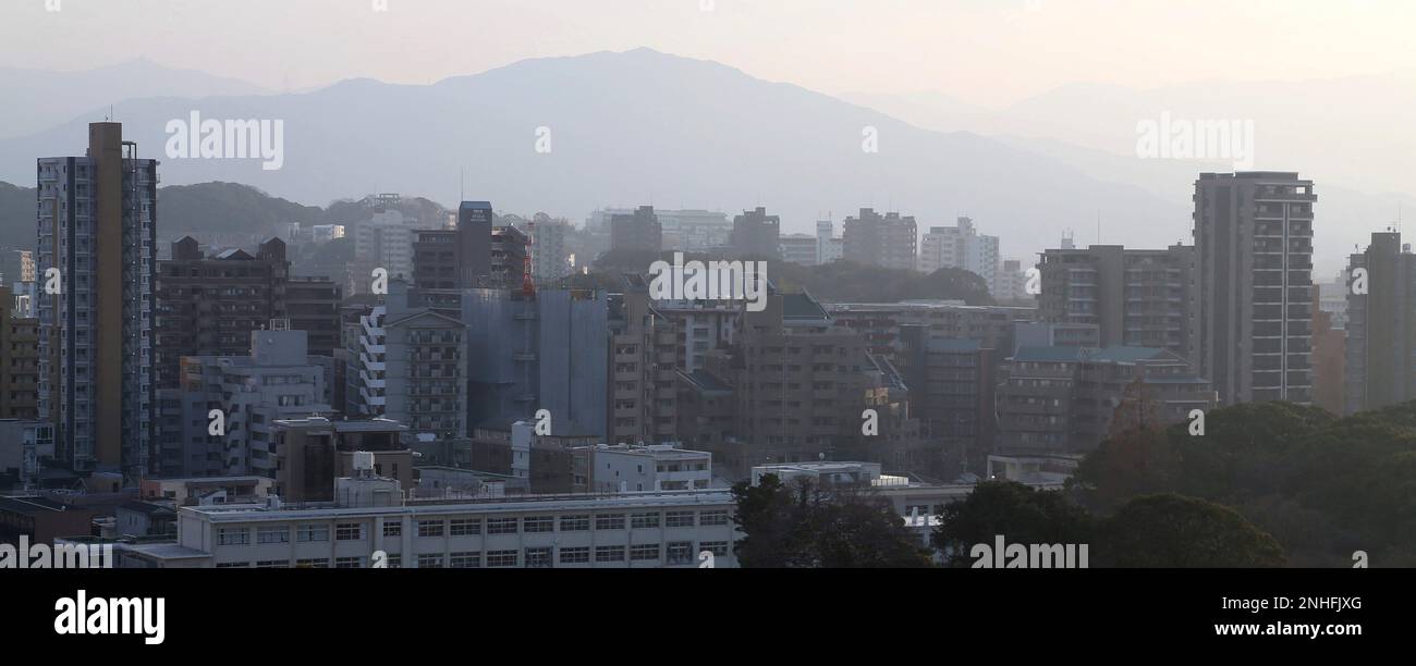 A photo shows yellow sand and air pollution covering the city of ...