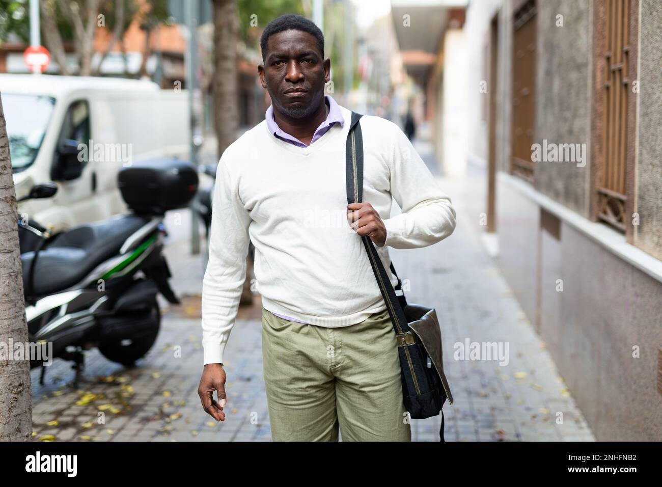 African-american man through city streets Stock Photo - Alamy