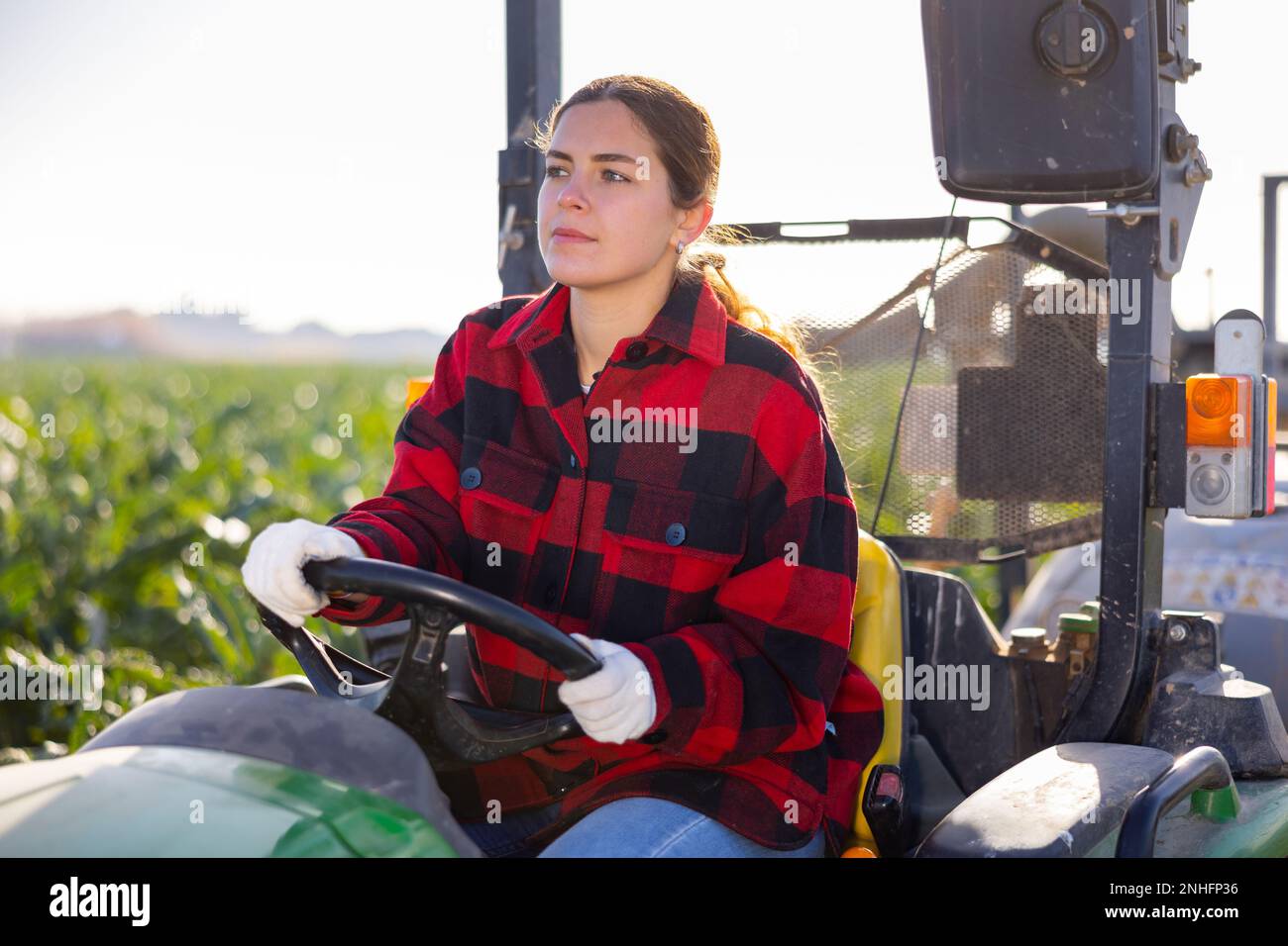 Woman driving tractor cabin hi-res stock photography and images - Alamy