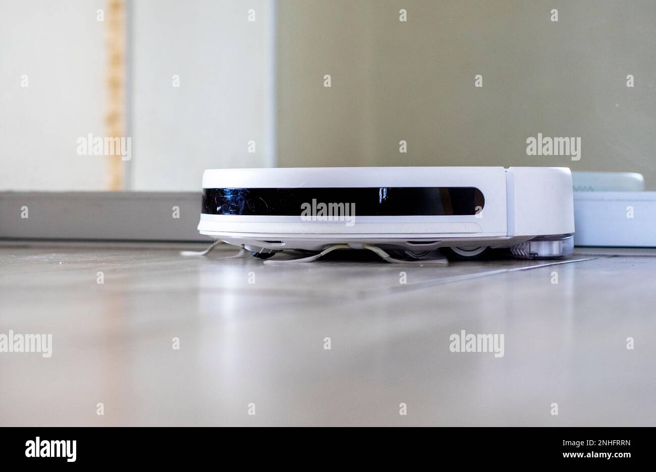 vacuum cleaner robot is automatically programmed to clean the room ...