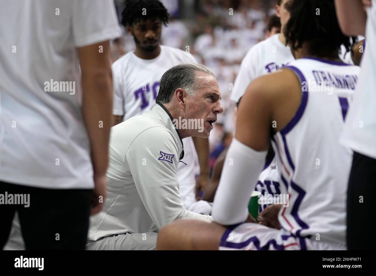 TCU head coach Jamie Dixon instructs the team in a huddle during an ...