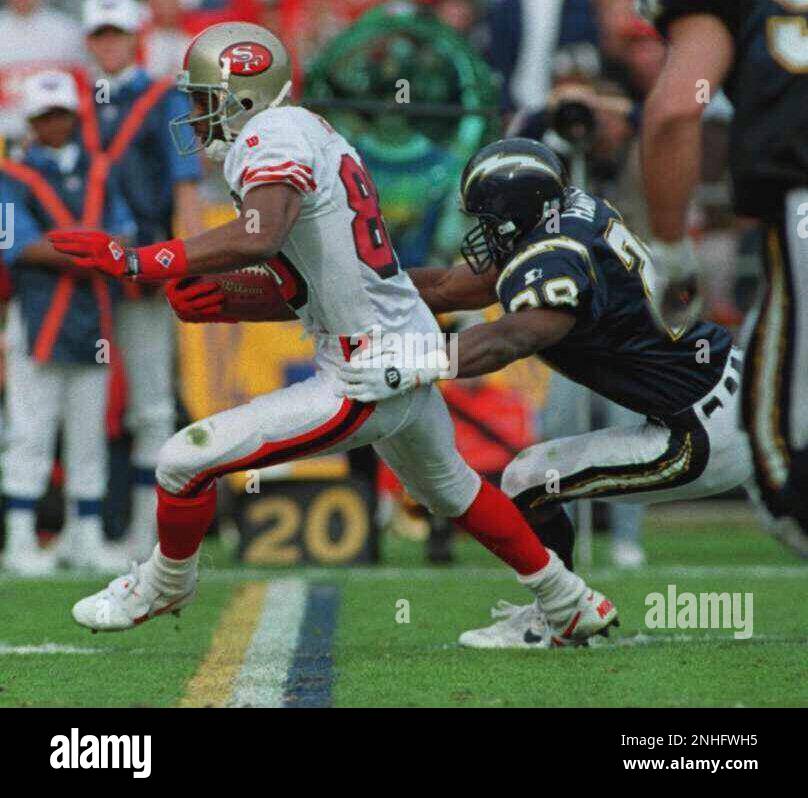 49ERS/CHARGERS - Jerry Rice crosses the 20 yd line with Chargers Dwayne ...