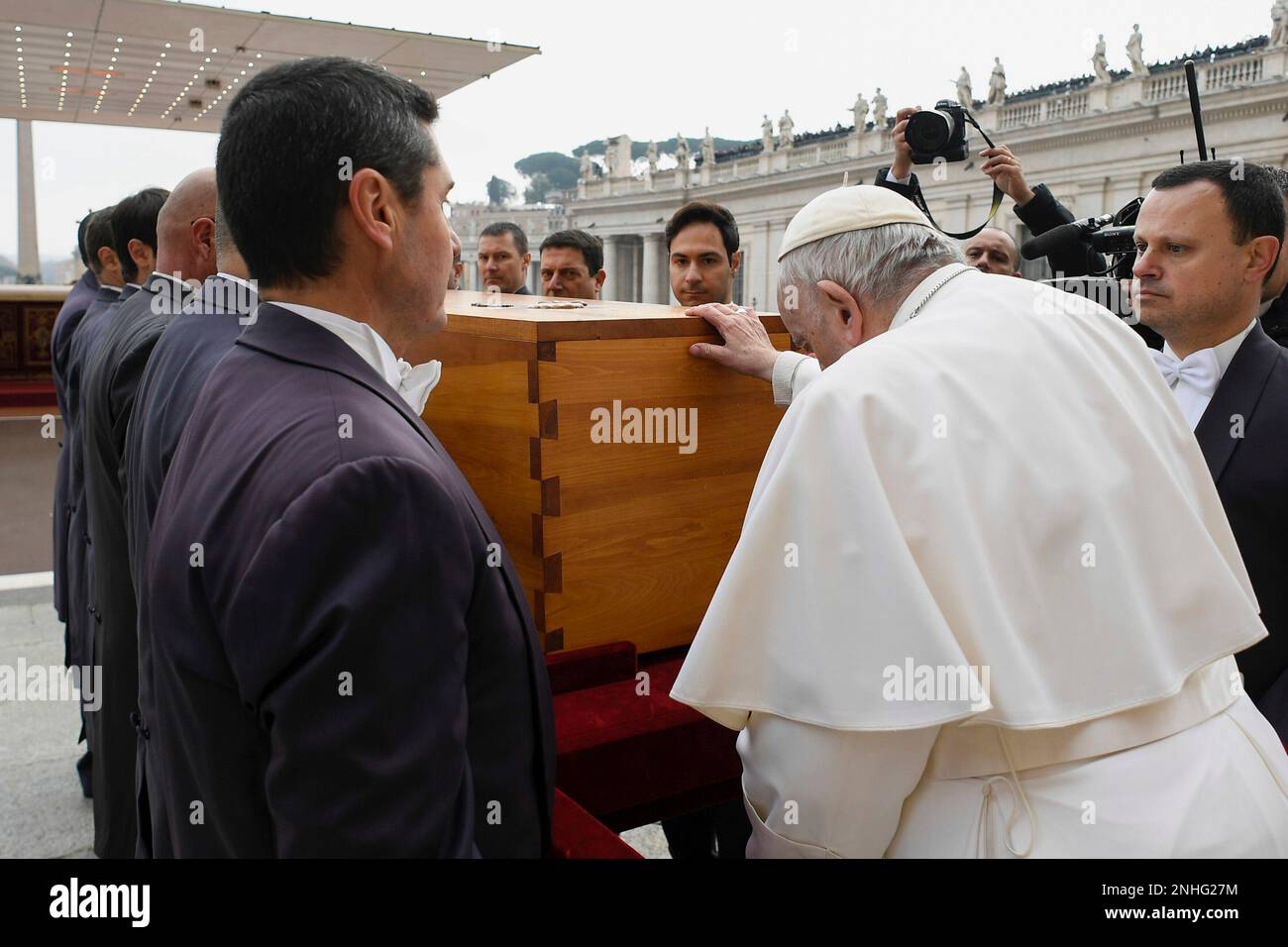 Pope Francis lays his hand on the coffin during the funeral of Pope ...