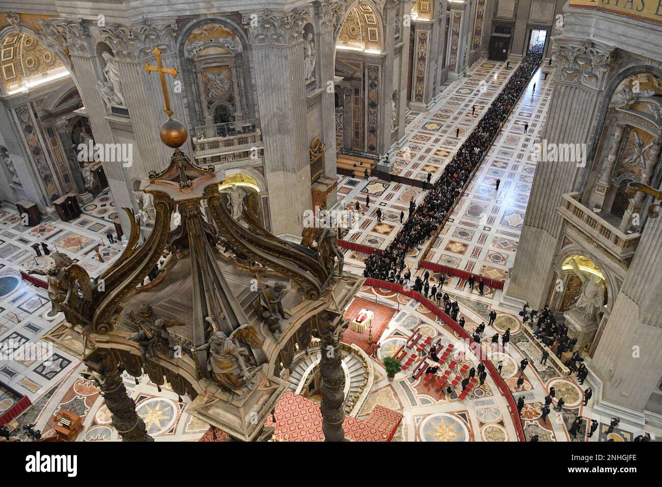 Hundreds of people look at Pope Emeritus Benedict XVI in the chapel at ...