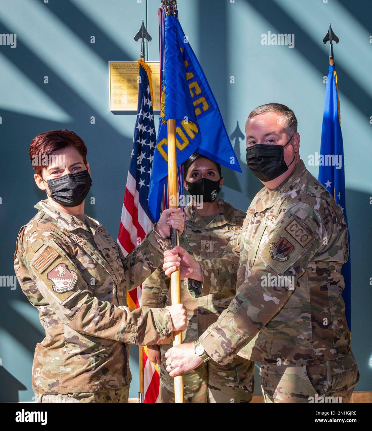 Col. Tammy McElhaney, 4th Mission Support Group commander, passes the ...