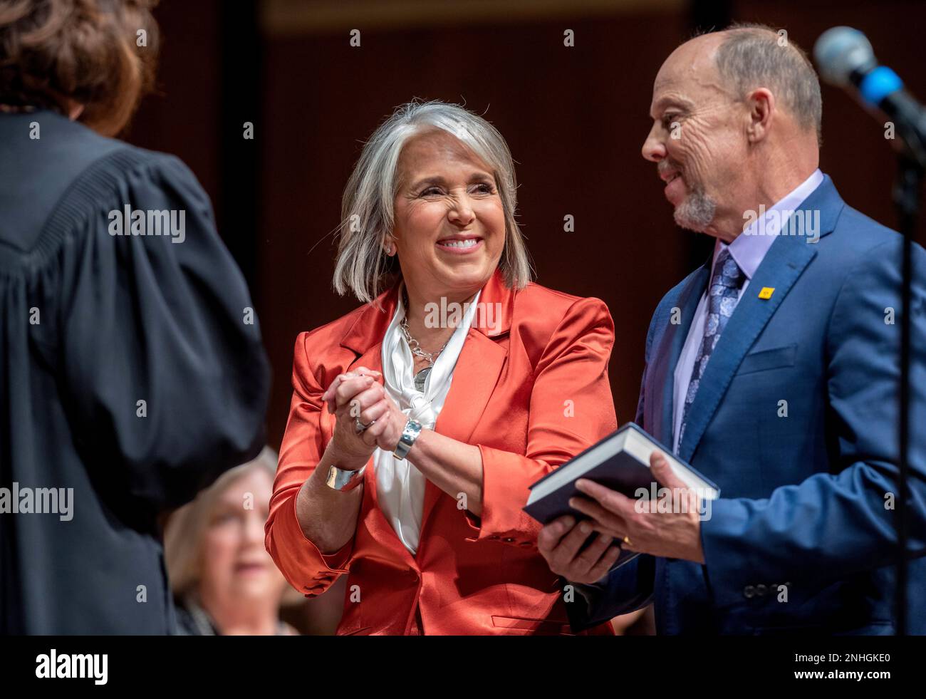 Gov. Michelle Lujan Grisham, center, standing with her brother Greg ...