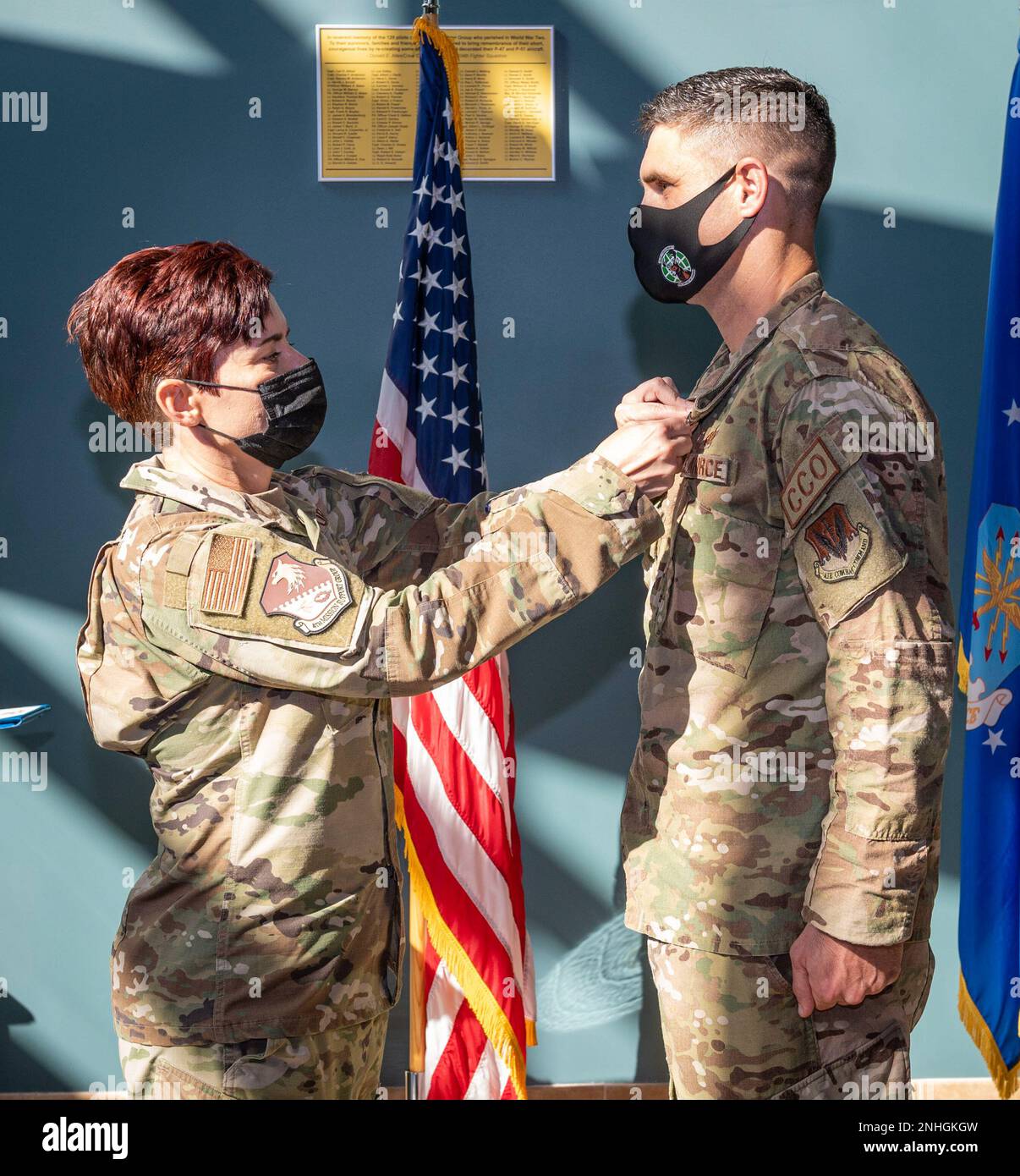 Col. Tammy McElhaney, left, 4th Mission Support Group commander, pins ...