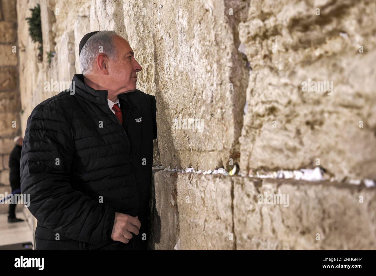 Israel's Prime Minister Benjamin Netanyahu places a prayer note between ...