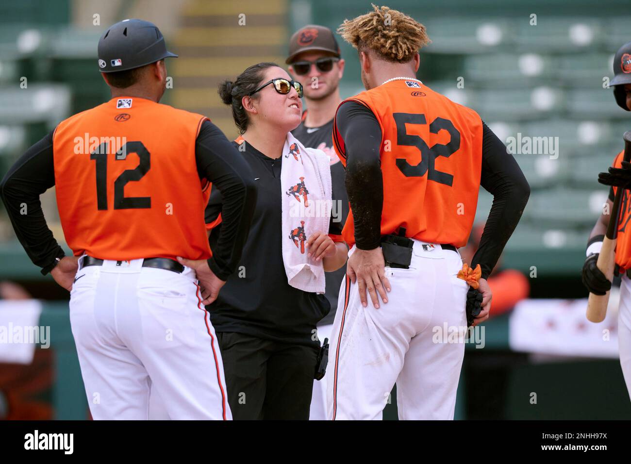 FCL Orioles trainer Sara Padilla checks on Rolphy Cruz (52) as manager ...