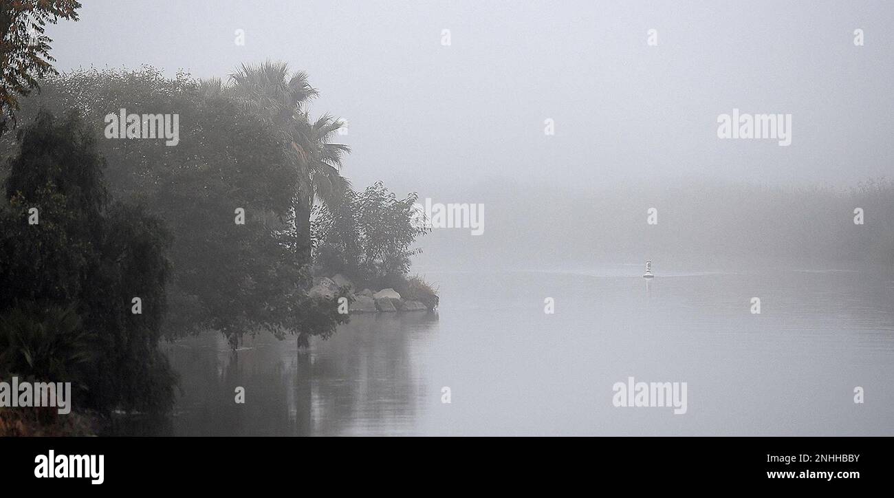 The Colorado River flows south from Gateway Park during morning fog ...
