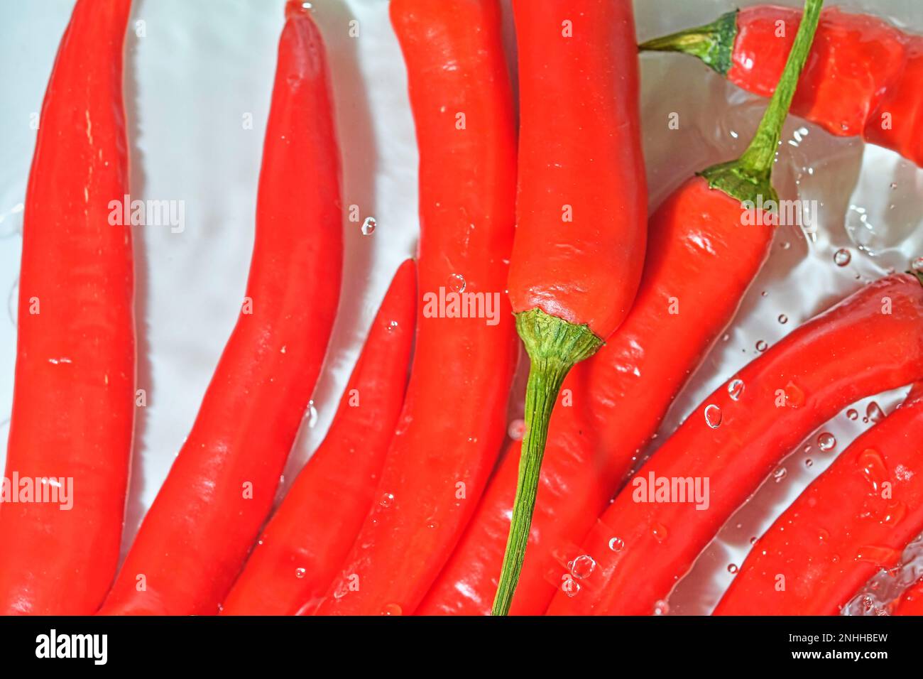 Red chilli peppers on white background. Hot chilli peppers close-up in ...
