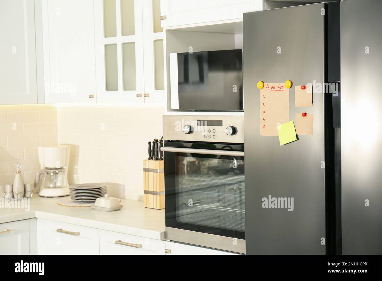 To do list and blank notes on refrigerator indoors. Space for text ...