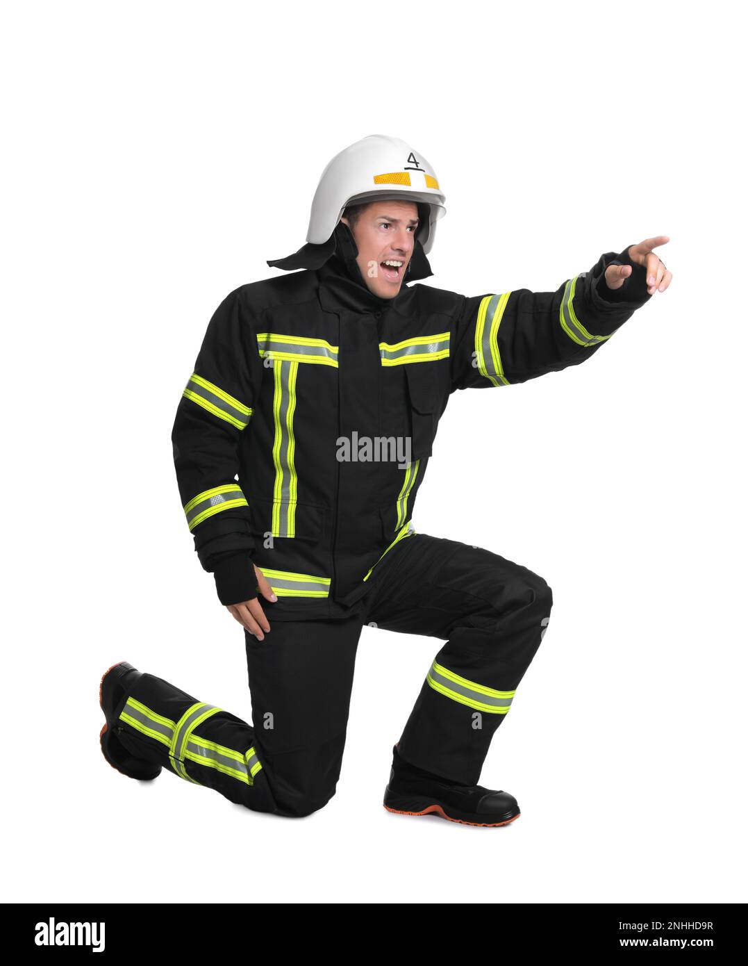 Full length portrait of firefighter in uniform and helmet on white ...
