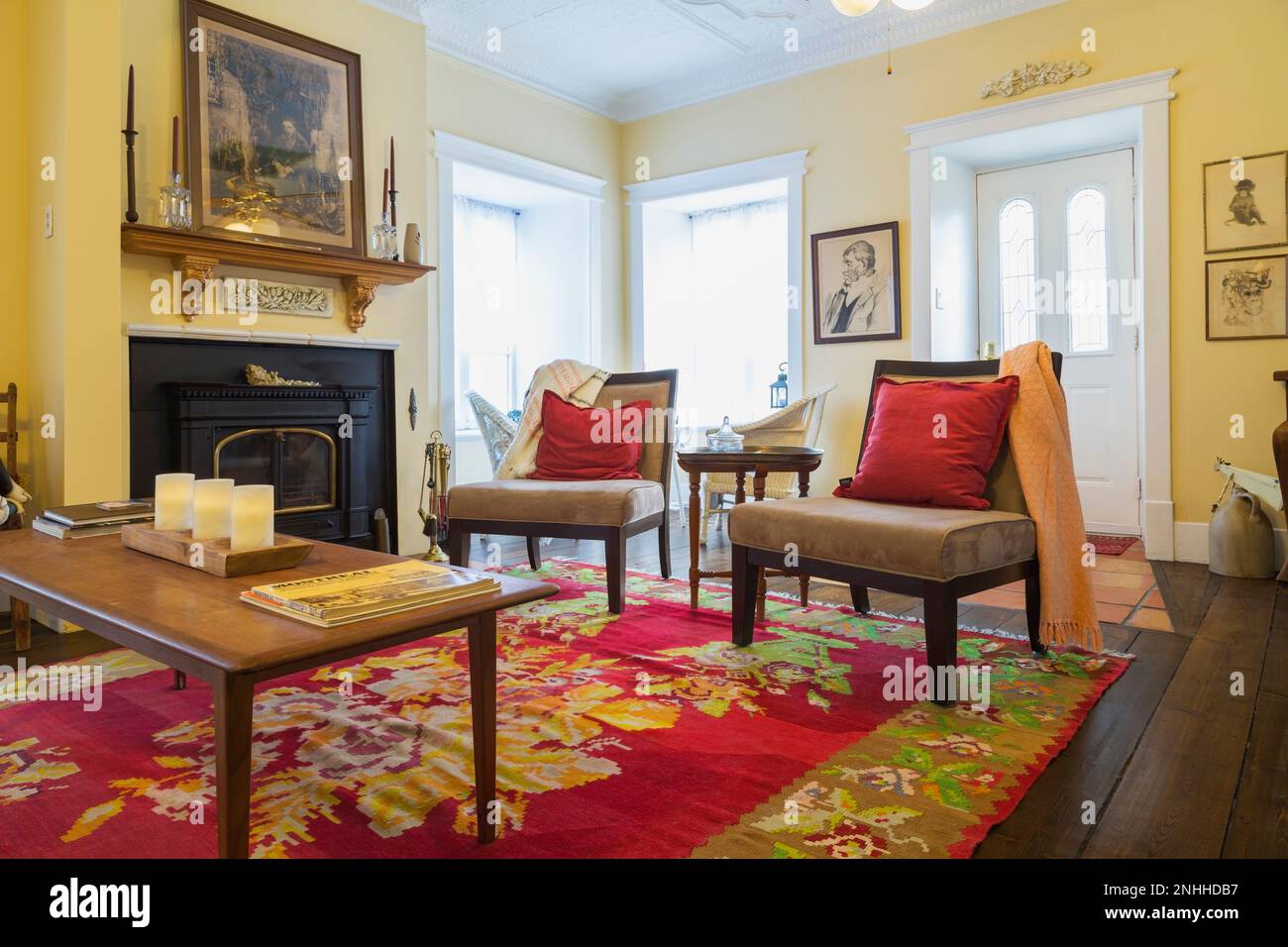 Teak wood coffee table and Eclectic chairs in living room with Vermont ...
