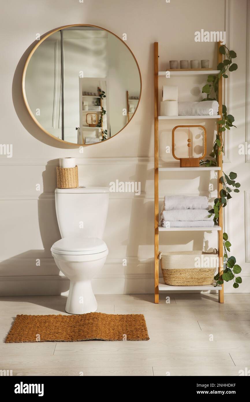 Modern toilet bowl in comfortable restroom. Interior design Stock Photo ...