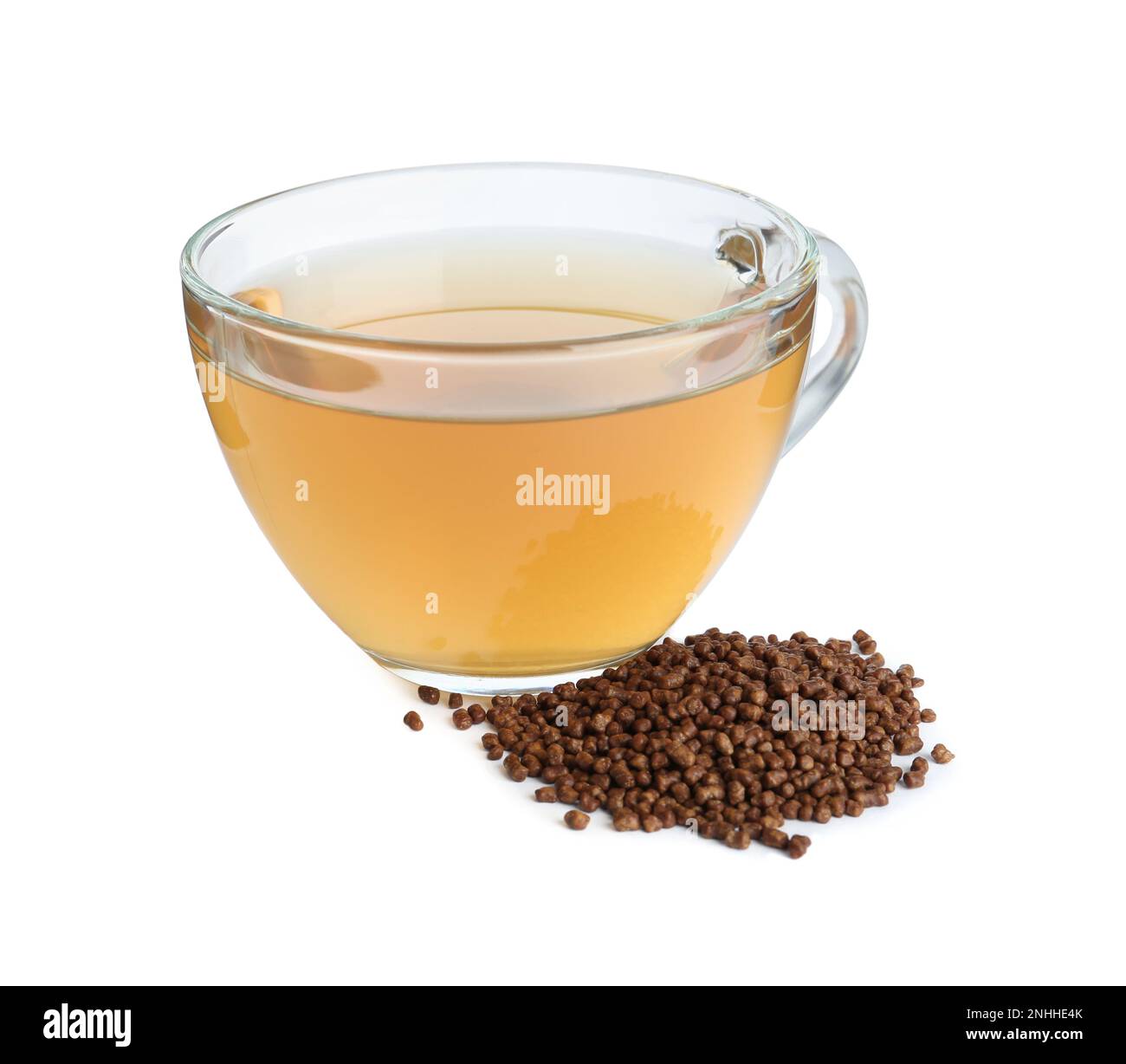 Glass cup of buckwheat tea and granules on white background Stock Photo ...