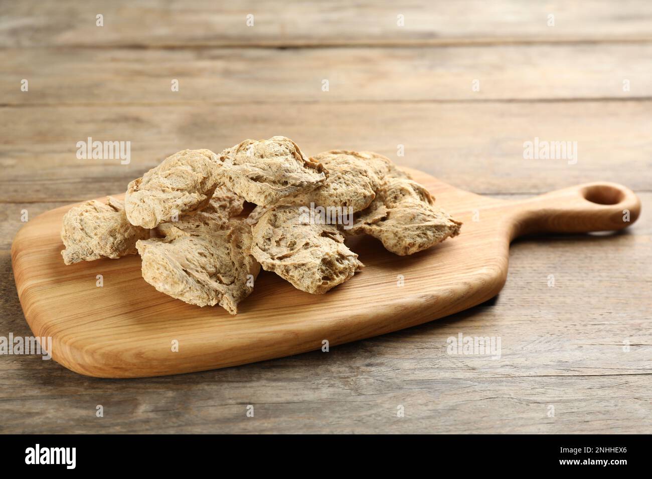 Dried soya chunks on wooden table. Meat substitute Stock Photo - Alamy