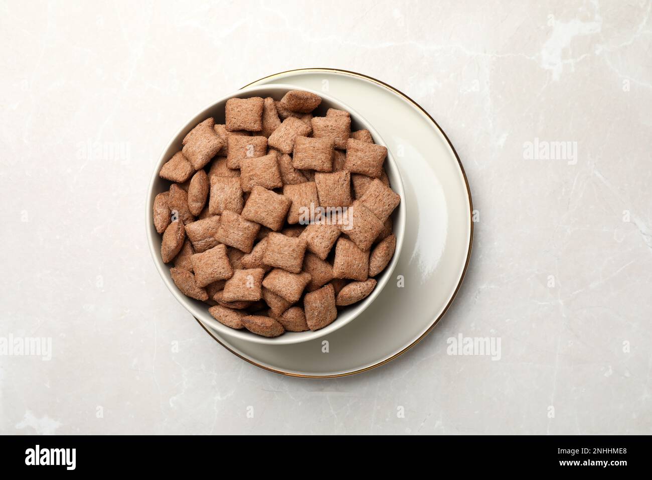 Sweet crispy corn pads in bowl on light marble table, top view Stock ...