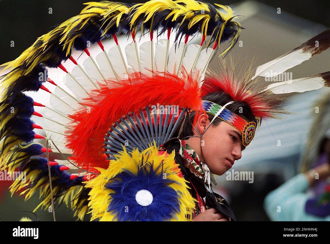 JASON CAMPOS WEARS A TRADITIONAL FEATHER BUSTLE OF THE PAWNEE TRIBE AT ...