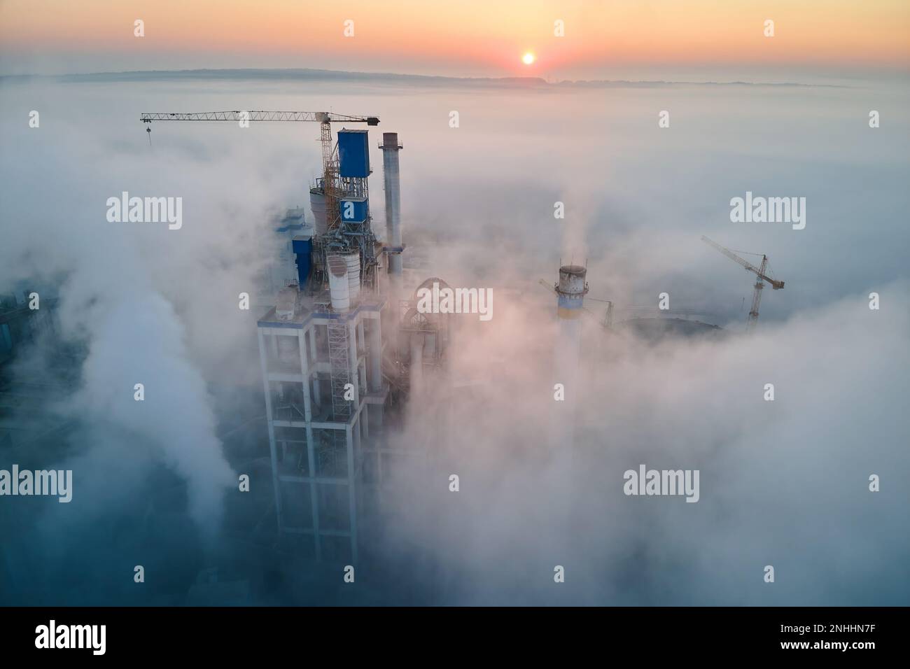 Aerial view of cement factory with high concrete plant structure and ...