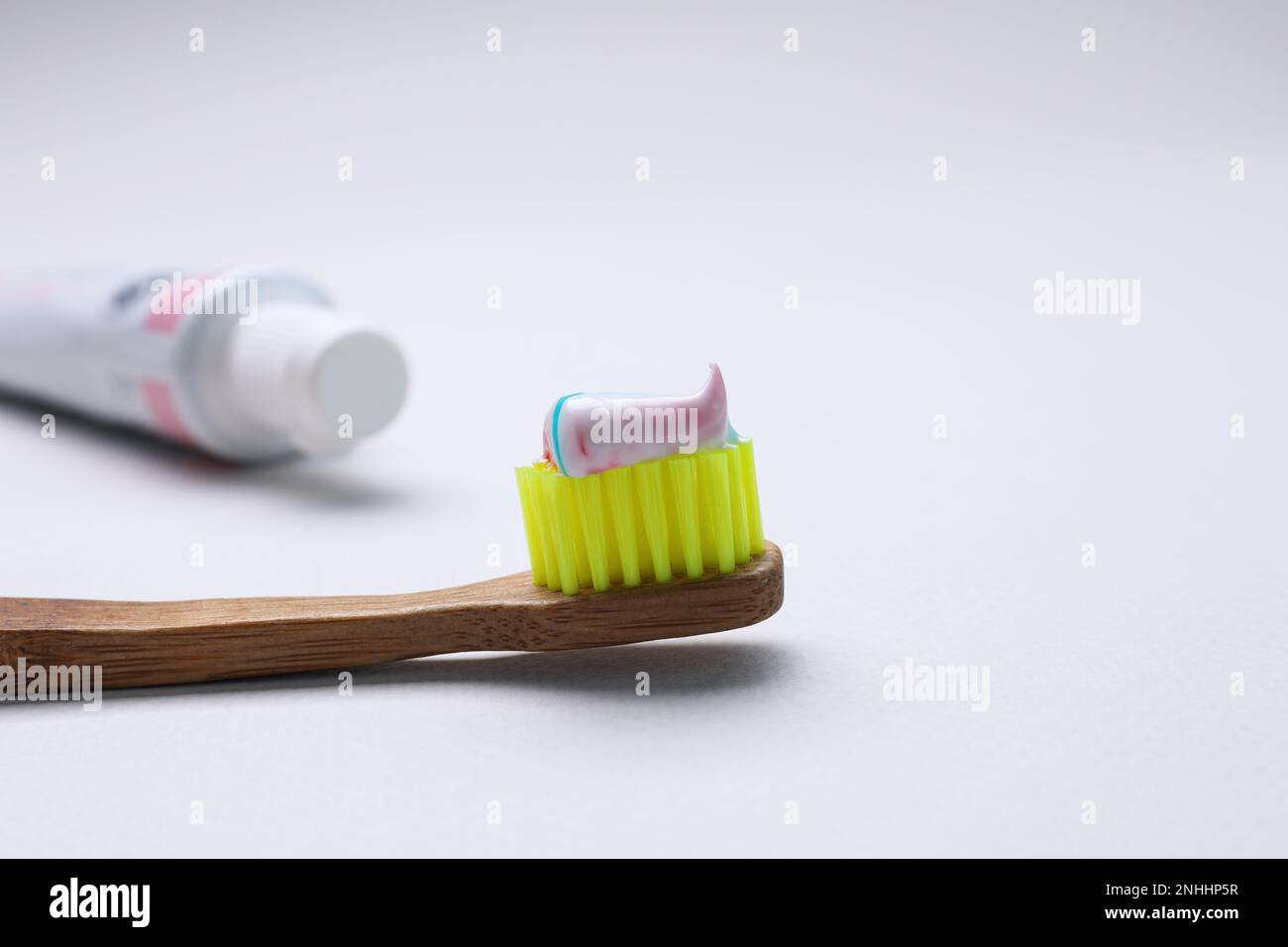 Brush with toothpaste and tube on white background, closeup Stock Photo ...