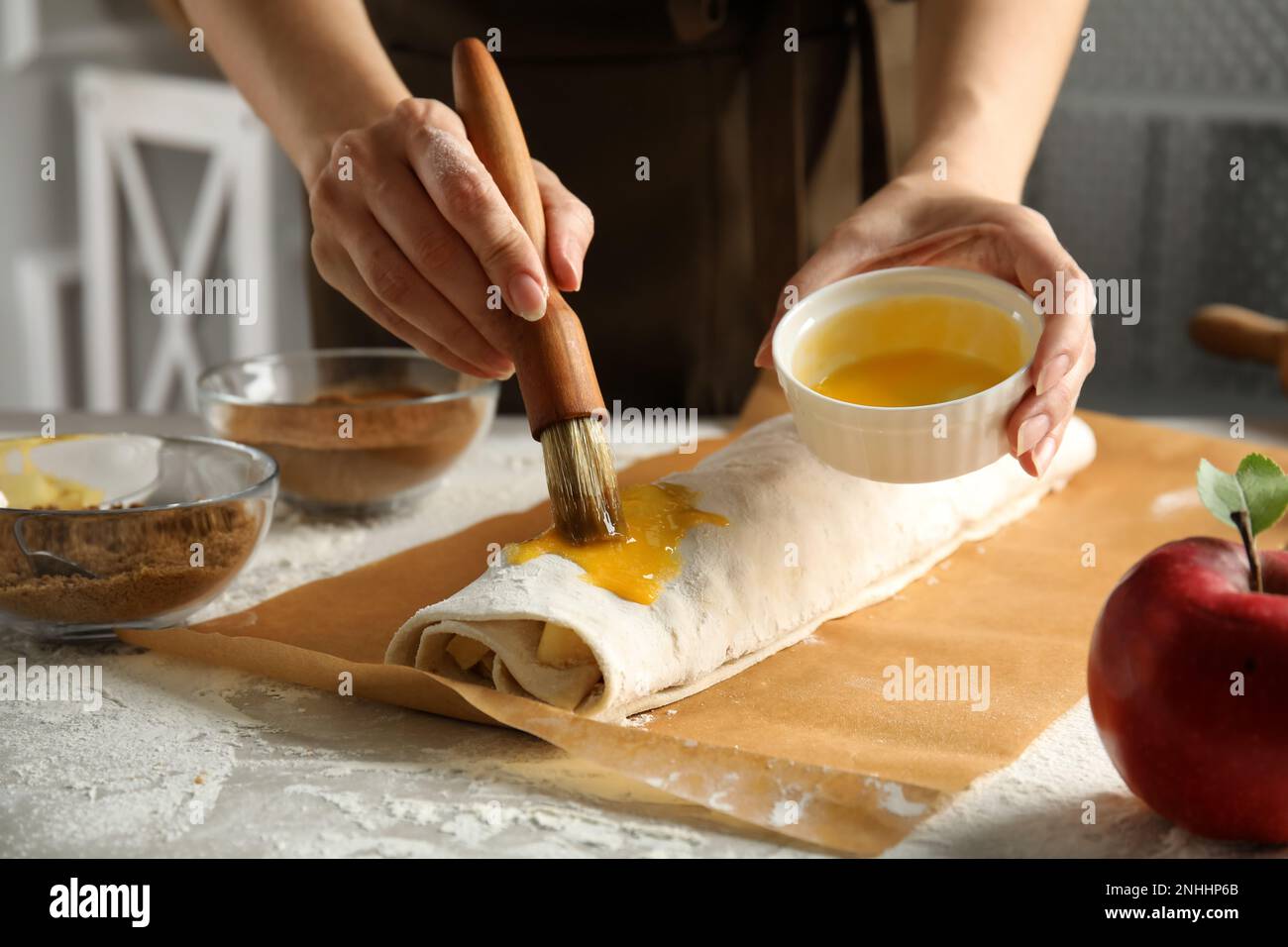 Woman making delicious apple strudel hi-res stock photography and ...