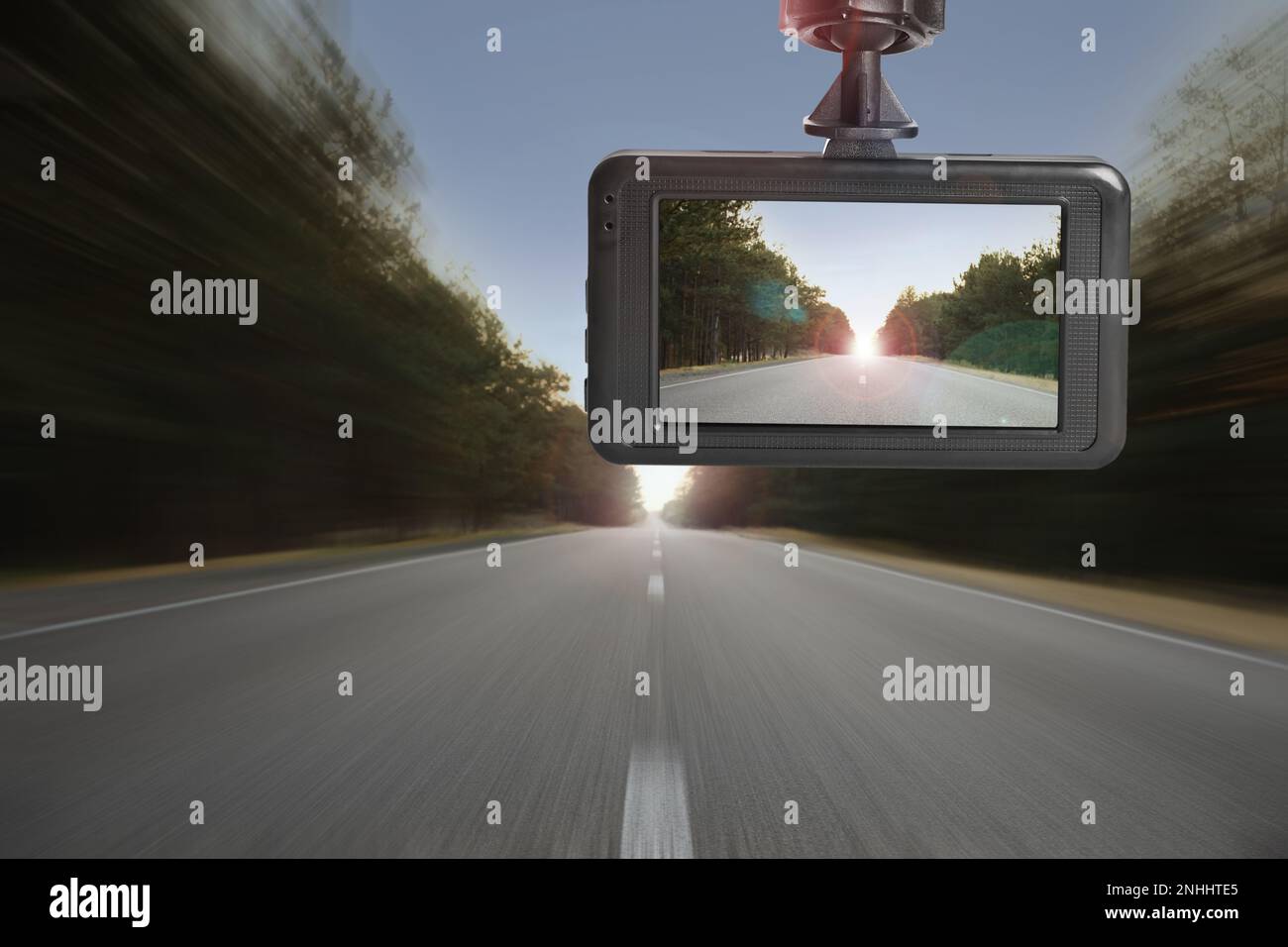 Modern dashboard camera mounted in car, view of road during driving ...