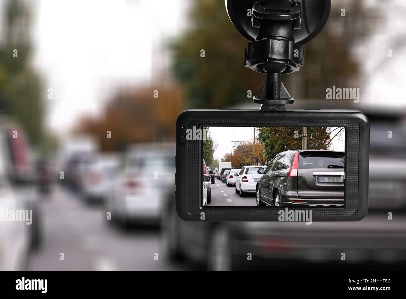 Modern dashboard camera mounted in car, view of road during driving ...