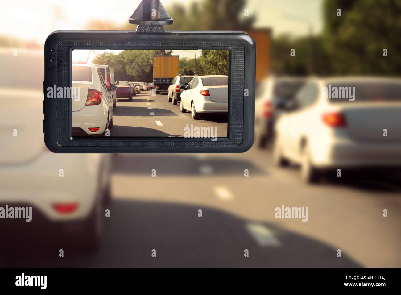 Modern dashboard camera mounted in car, view of road during driving ...