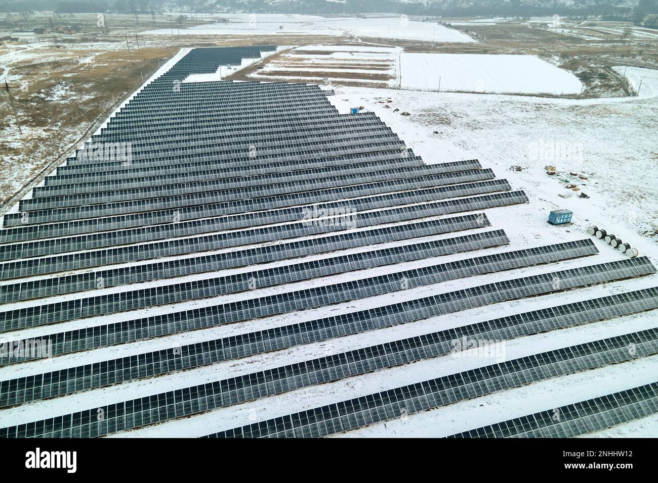 Aerial view of electrical power plant with solar panels covered with ...