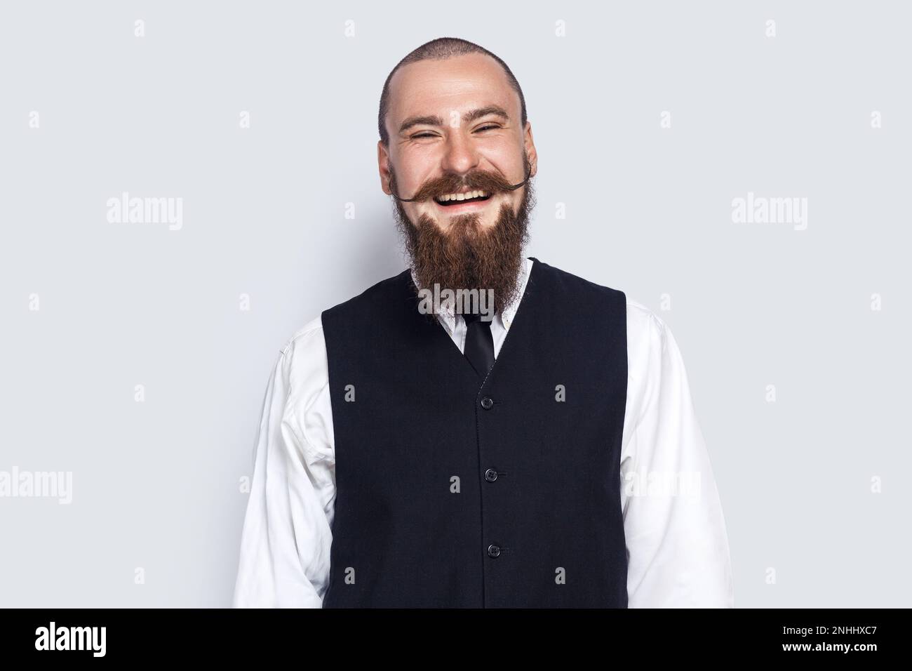 Portrait of excited attractive young adult man with beard and mustache ...